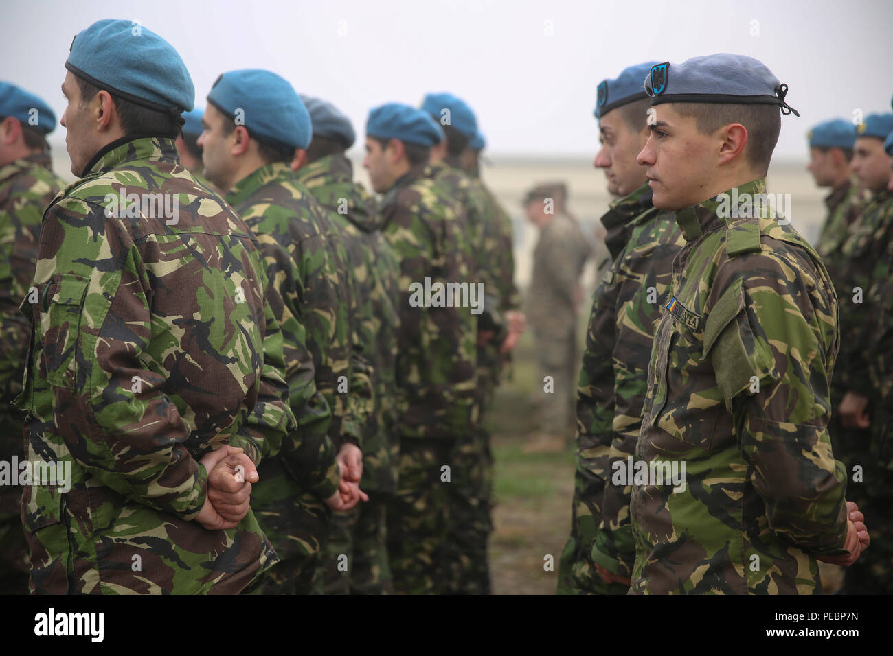Romanian soldiers stand with U.S. Marines to commemorate the 74th ...