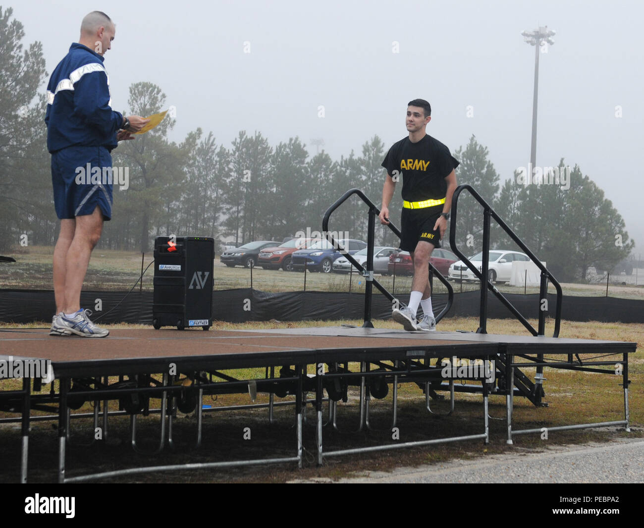 Pfc. Jonah Flanders recieves an certificate for fastest male run time ...