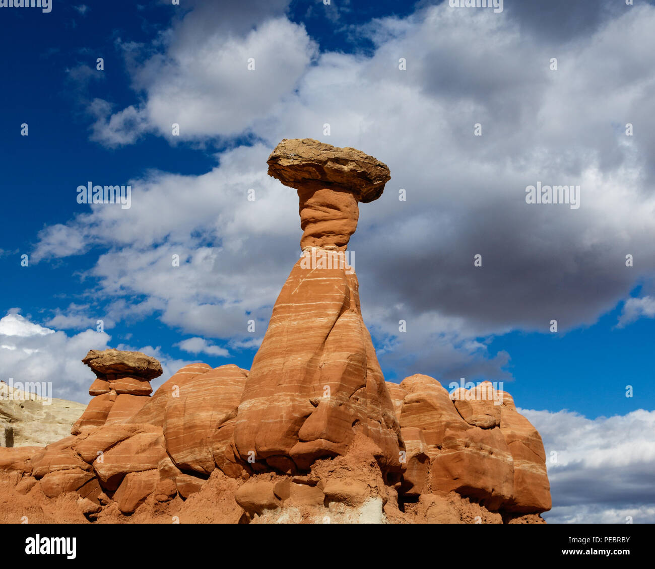 Red Toadstool hoodoo formation, in Southern Utah's badlands. Blue sky ...