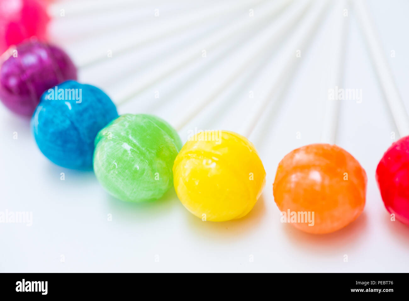 detailed image of colorful rainbow lollipops Stock Photo - Alamy