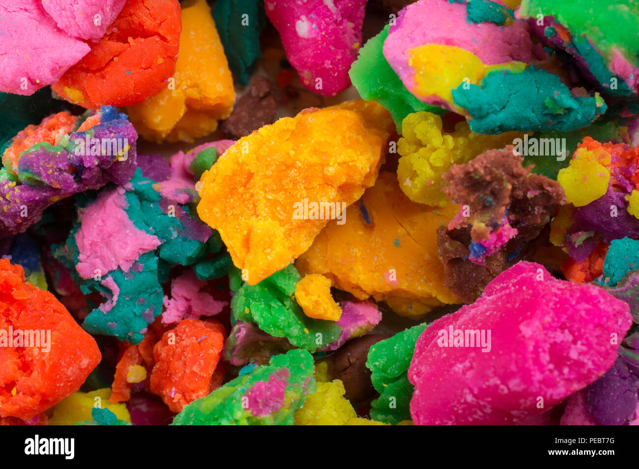 Dry colorful play dough in smal pieces Stock Photo - Alamy