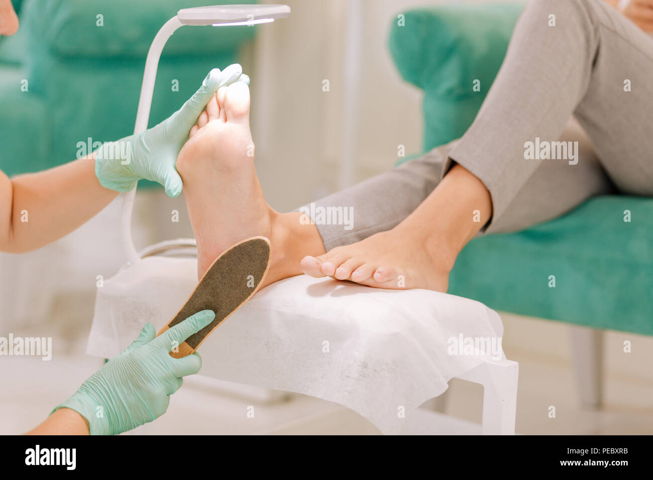 Professional female chiropodist working hard in her beauty salon Stock ...