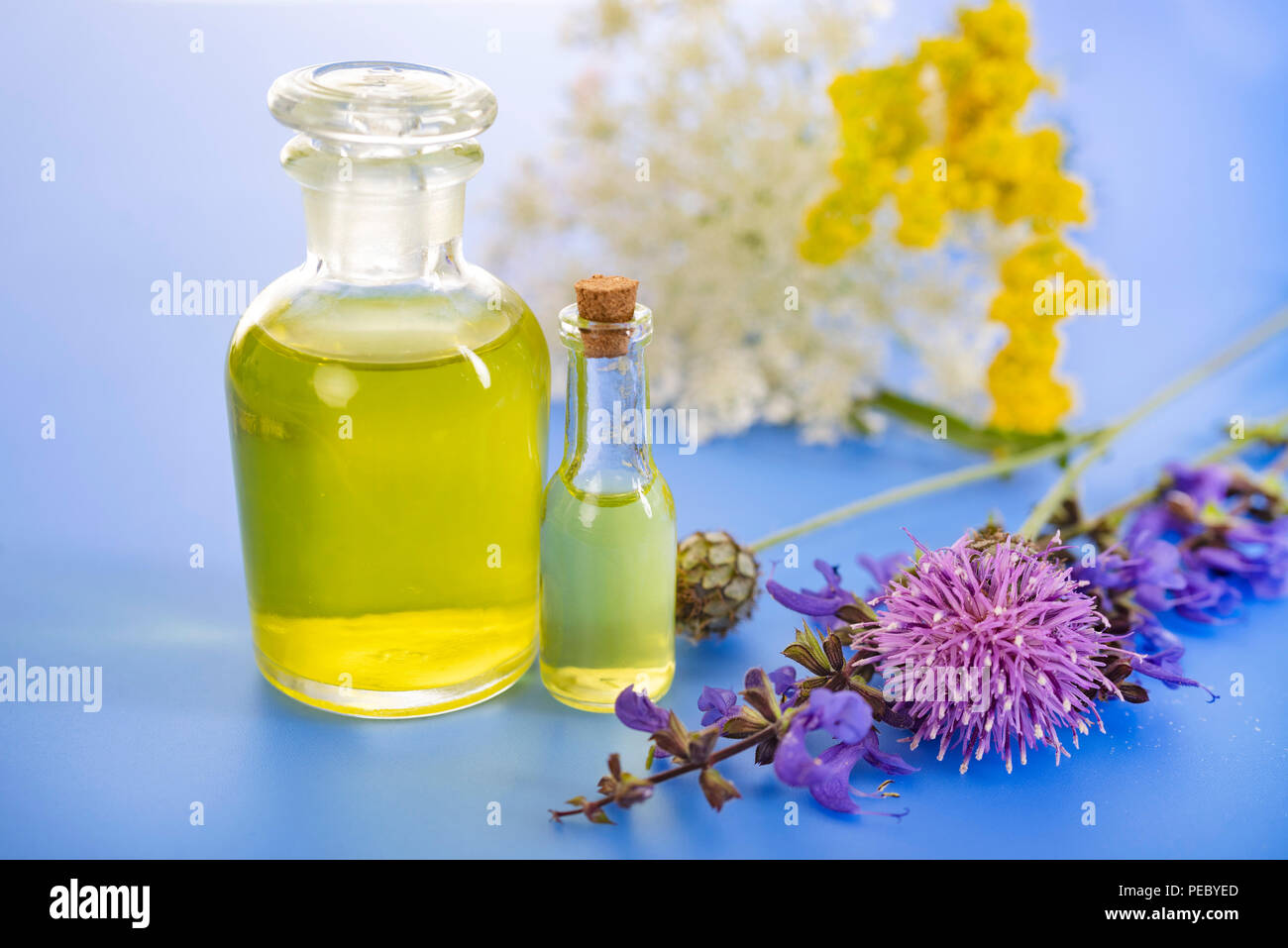 essential oils in front of white background Stock Photo - Alamy