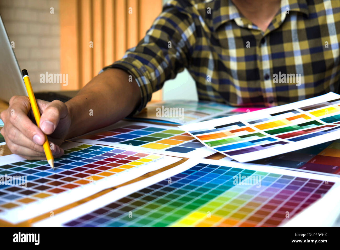 Graphic designers choose colors from the color bands samples for design ...