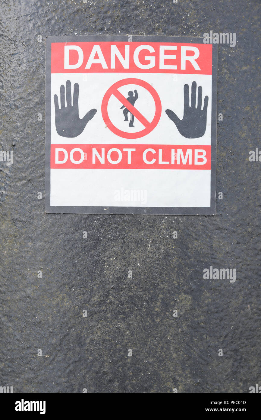 DANGER DO NOT CLIMB red and white warning sign with symbol of man ...
