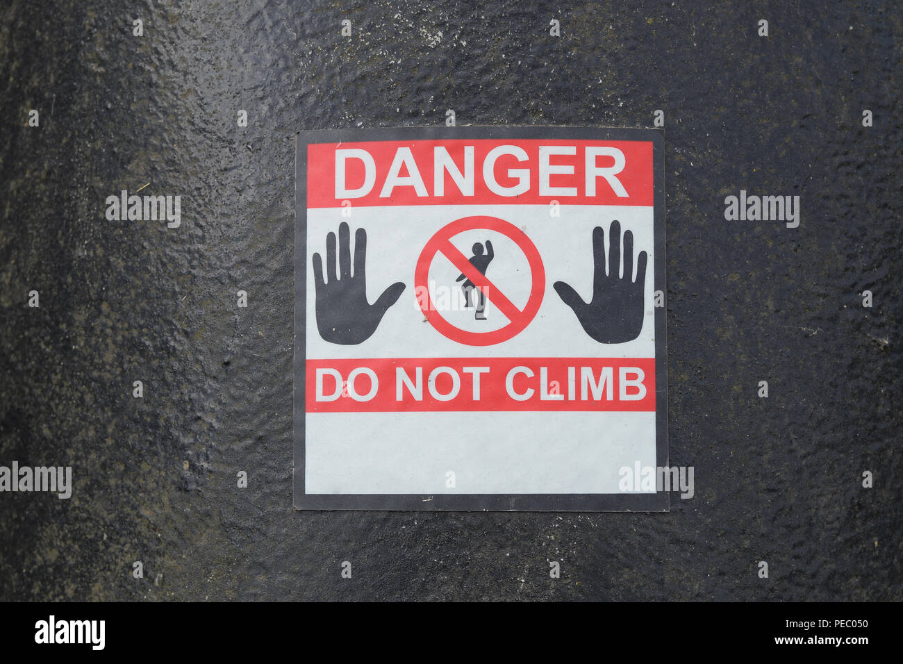 DANGER DO NOT CLIMB red and white warning sign with symbol of man ...
