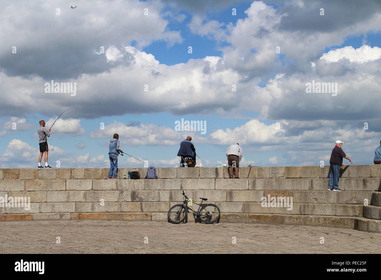 Fishing off the east pier in Howth,Dublin, Ireland. Rod fishing is a ...