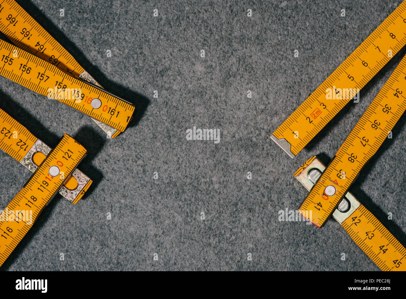 top view of collapsible meter on grey surface Stock Photo - Alamy