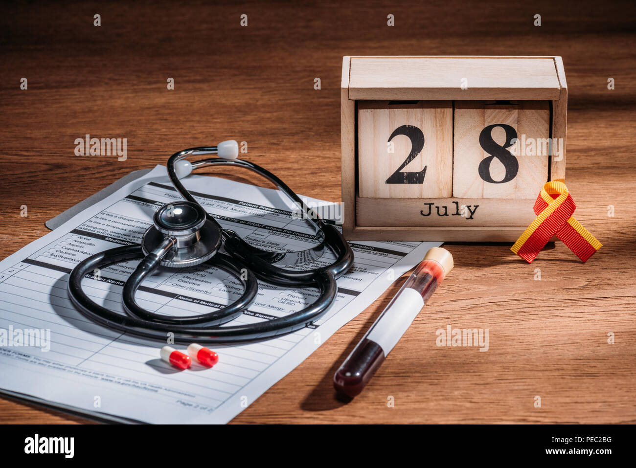 selective focus of wooden calendar with 28th jule date, medical ...