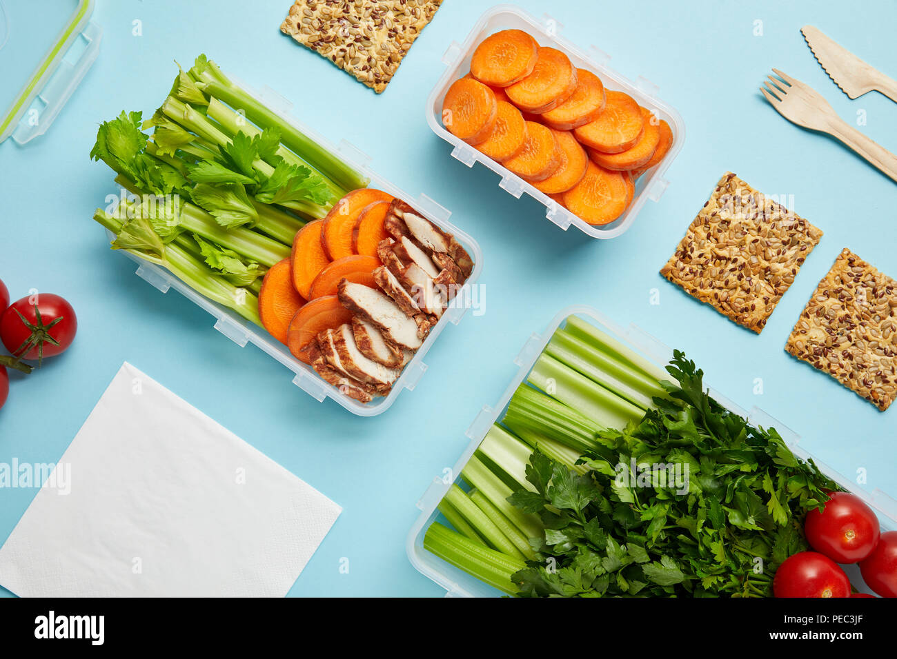 top view of arrangement of food containers with fresh healthy food ...