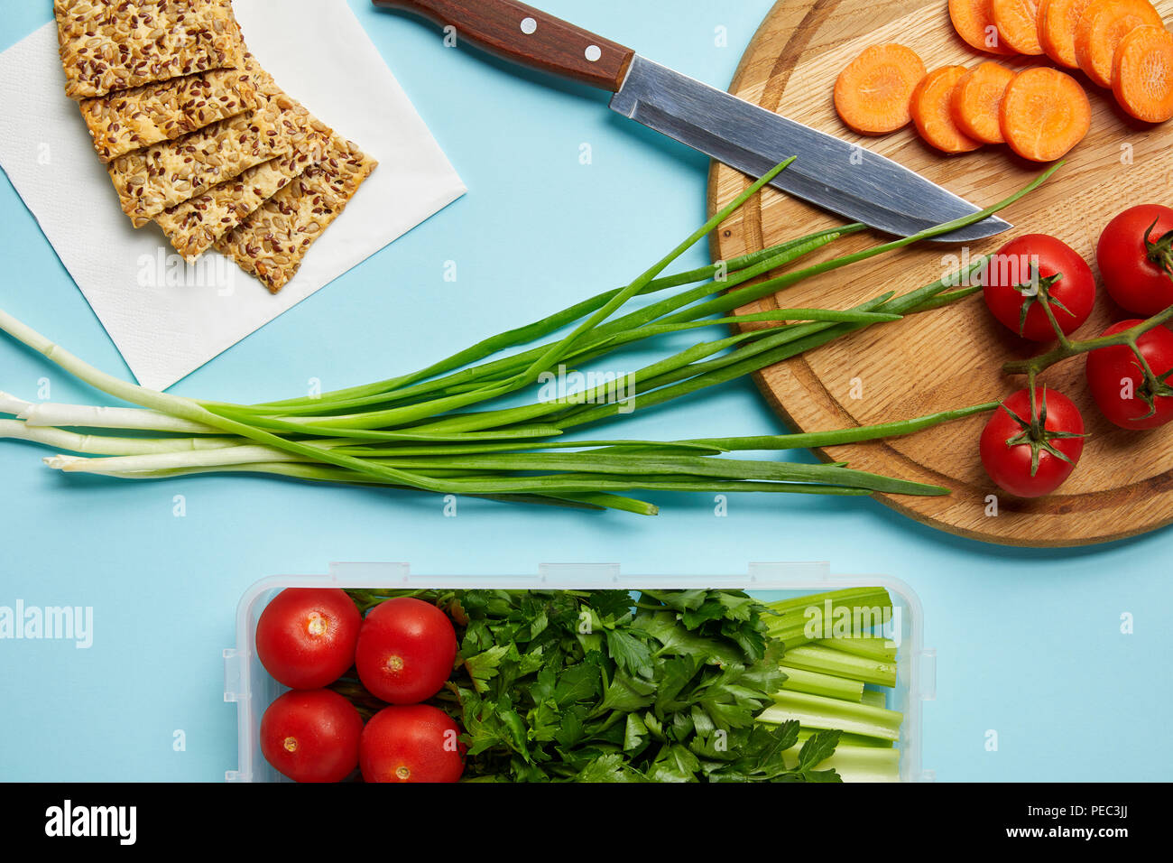 flat lay with knife and healthy food composition isolated on blue Stock ...
