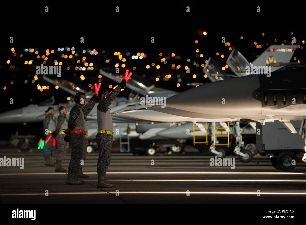 Colombian Air Force Kfir fighter jet crew chiefs signal a Kfir pilots ...