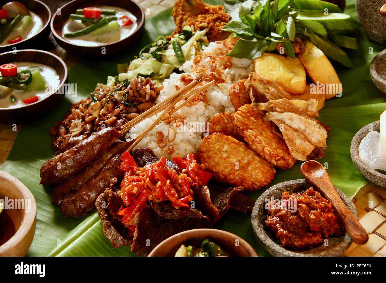 Indonesian Rijsttafel on Banana Leaf. Rice with various dishes from ...
