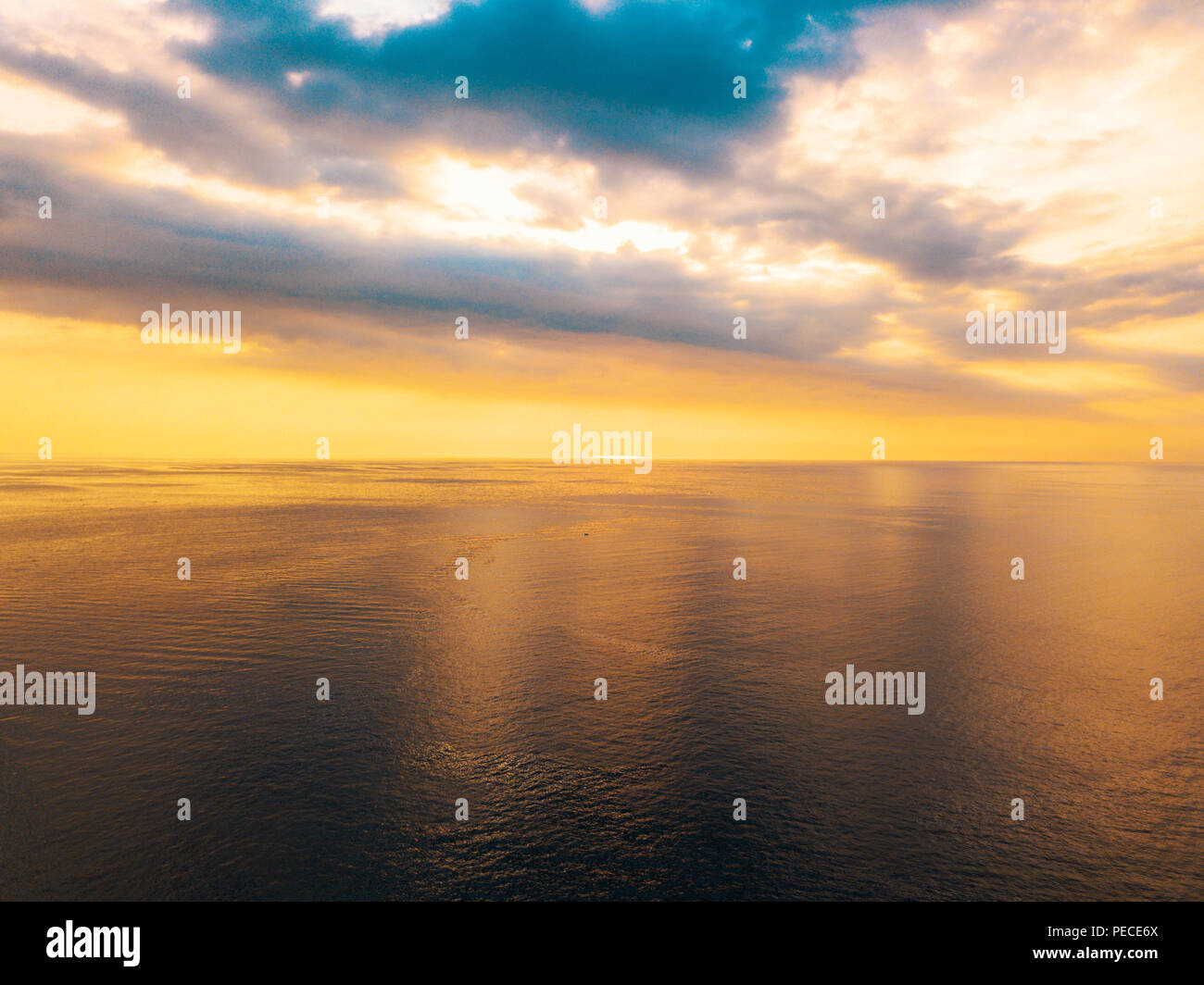 Aerial drone view of the sunset sky at the beach in Bali, Indonesia ...