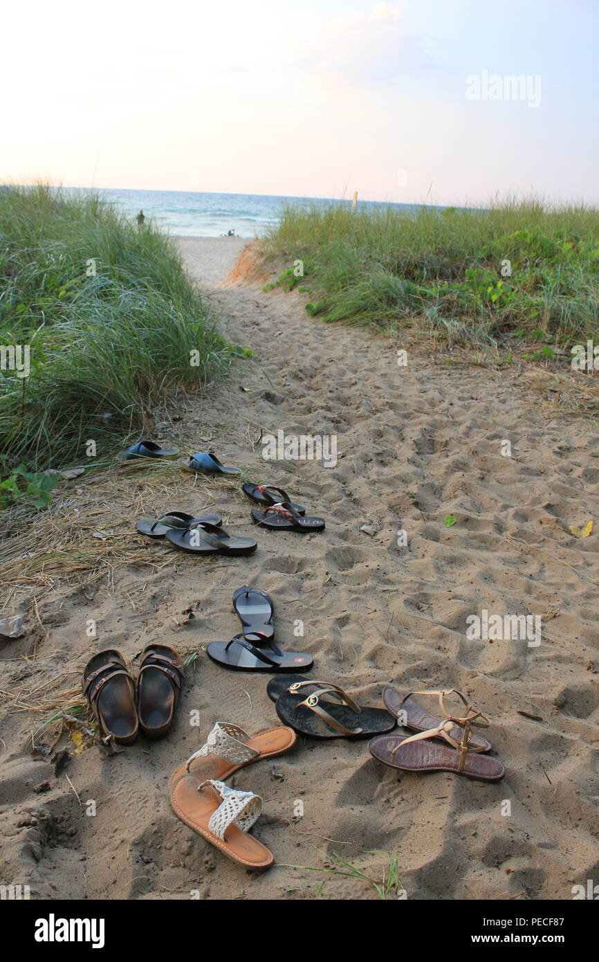 Summer evening on the beach in Union Pier, Michigan with flip flops ...