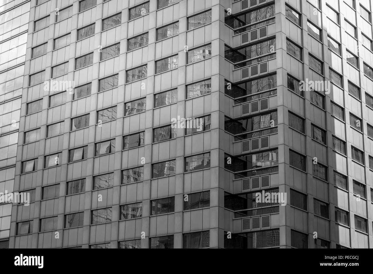 windows of commercial building in Hong Kong with B&W color Stock Photo ...