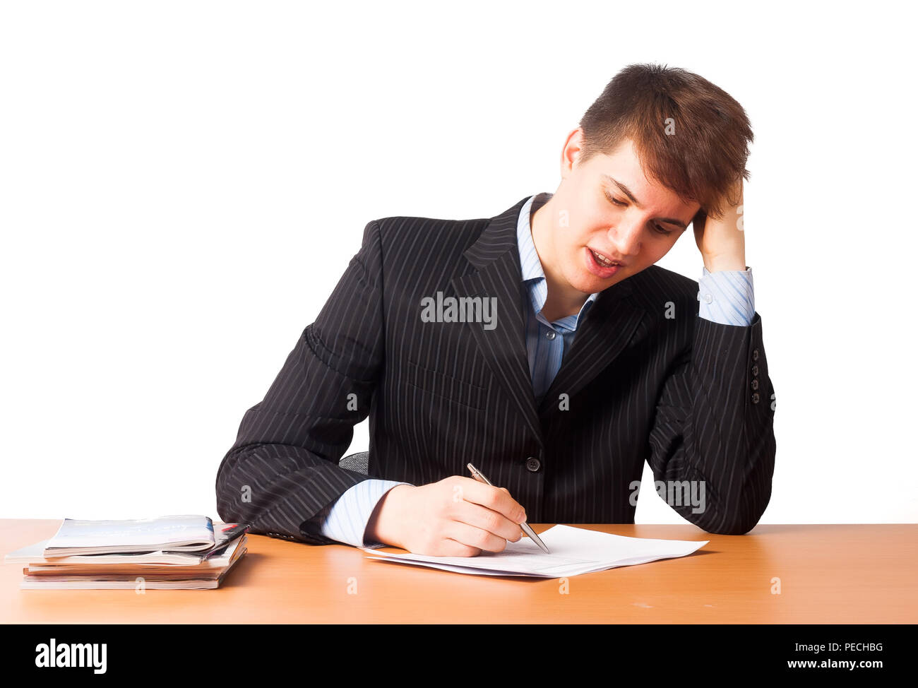 Cute man writing document Stock Photo - Alamy