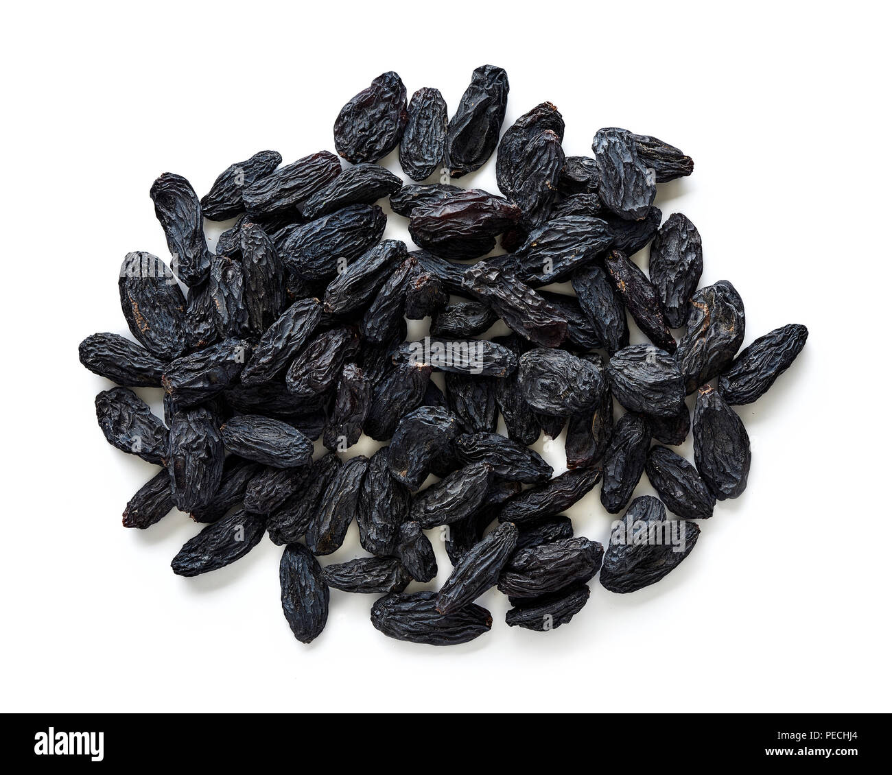 Heap of black raisins isolated on white background. Top view of dried ...