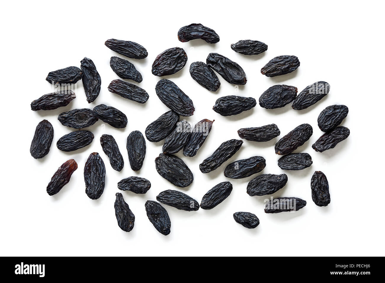Black raisins isolated on white background. Top view of dried grapes ...