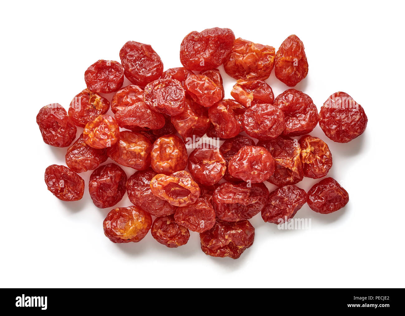 Heap of dried cherry tomatoes isolated on white background. Top view ...