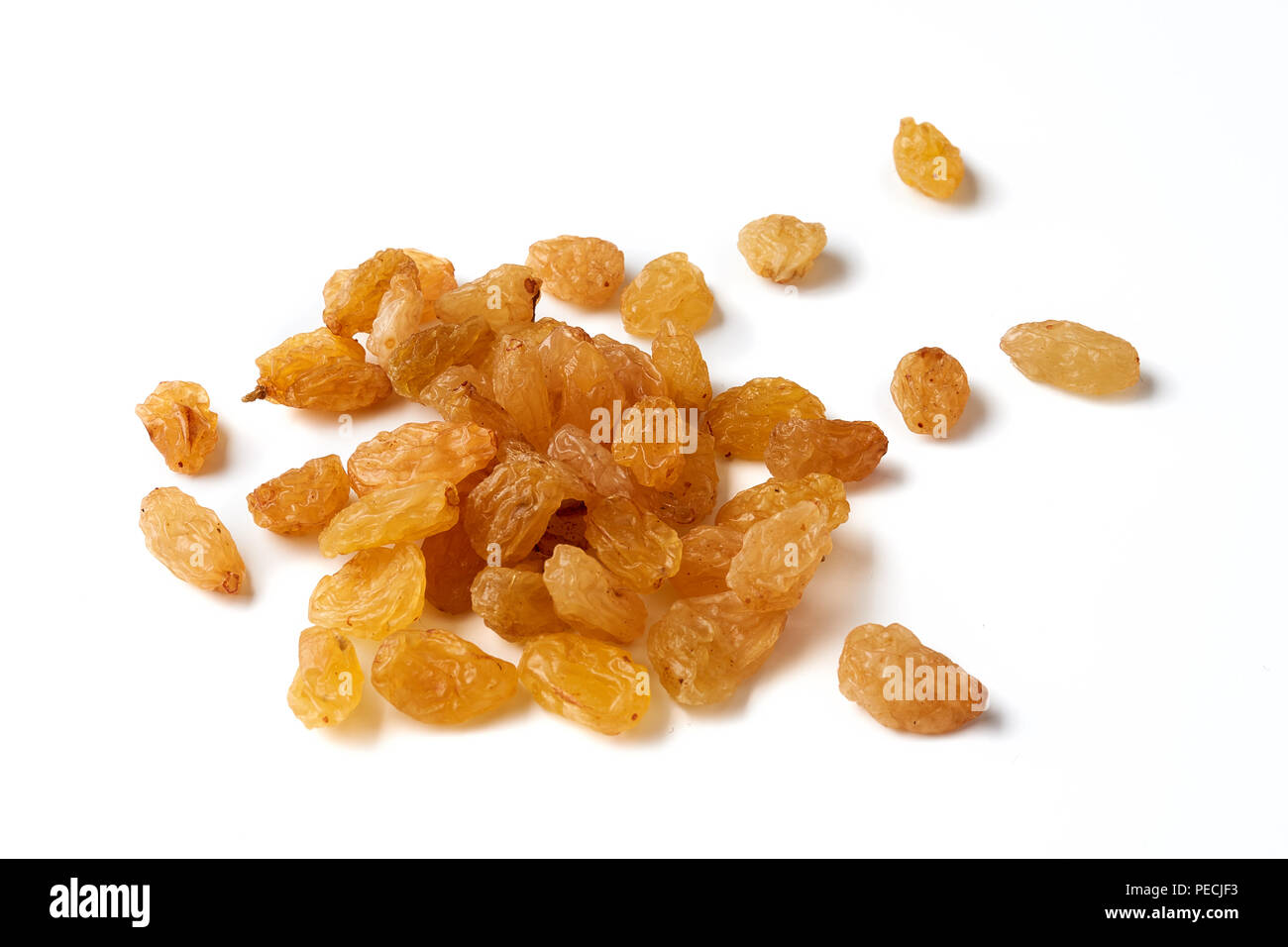 Heap of yellow raisins isolated on white background Stock Photo - Alamy