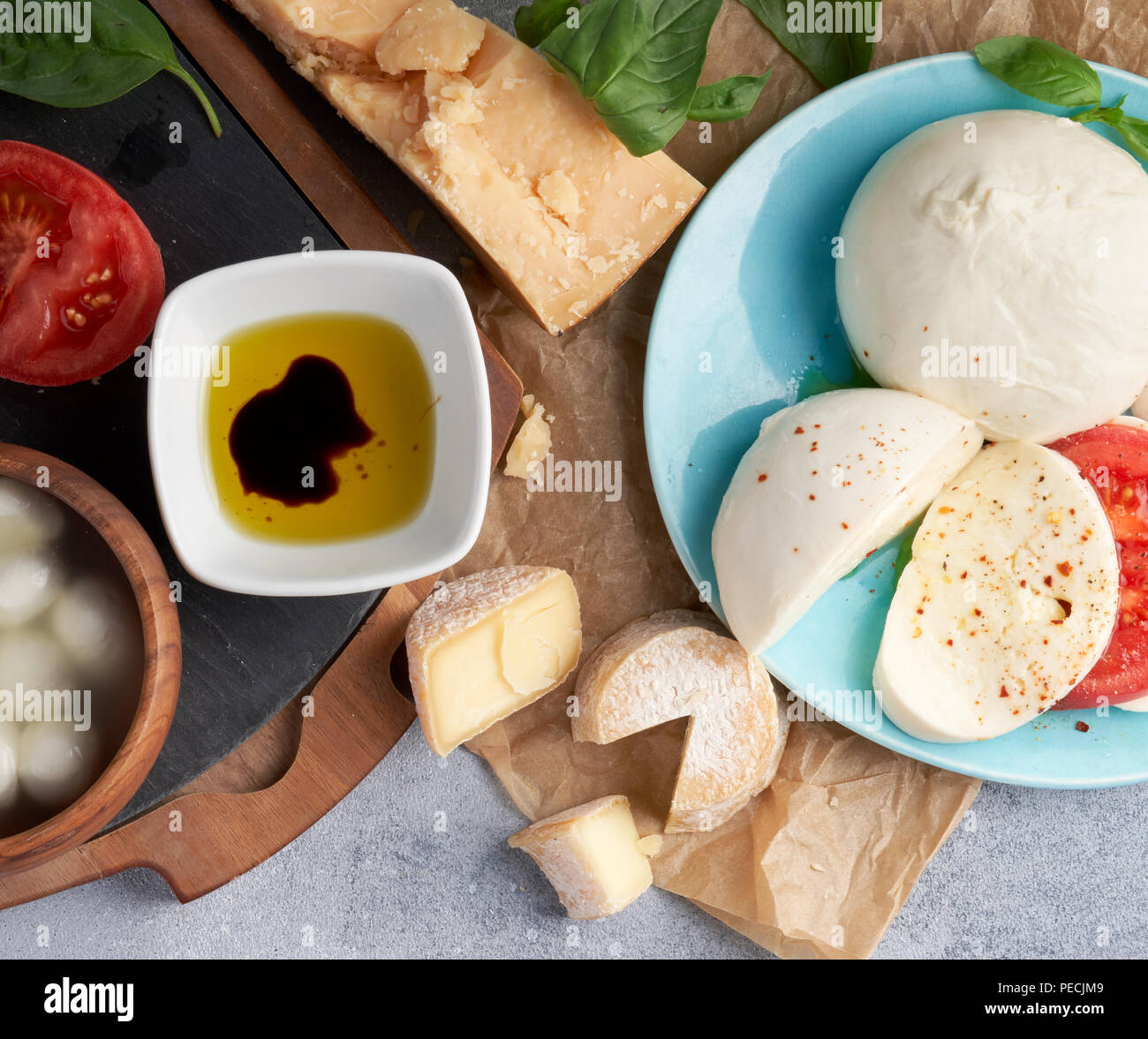 Italian cheeses. Mozzarella Buffalo, crottin, balls, Stracciatella ...