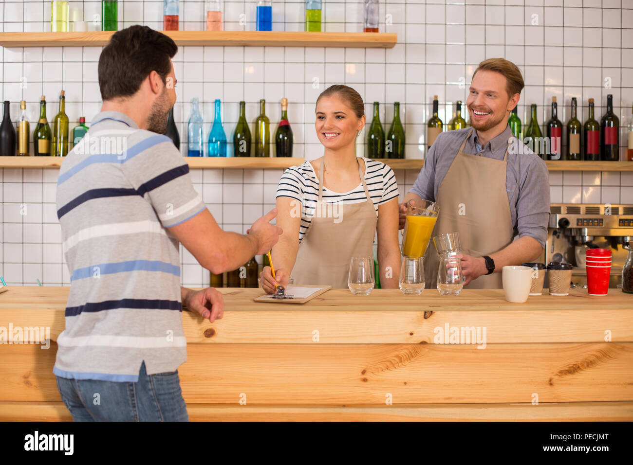 Employee worker counter taking order hi-res stock photography and ...