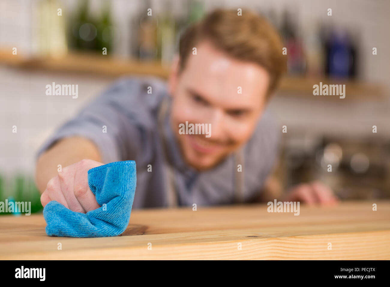 Absolutely clean. Selective focus of a duster being used for cleaning ...
