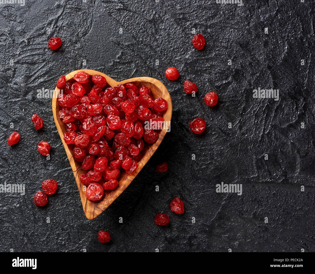 Dried red cherries on a black background with copy space Stock Photo ...