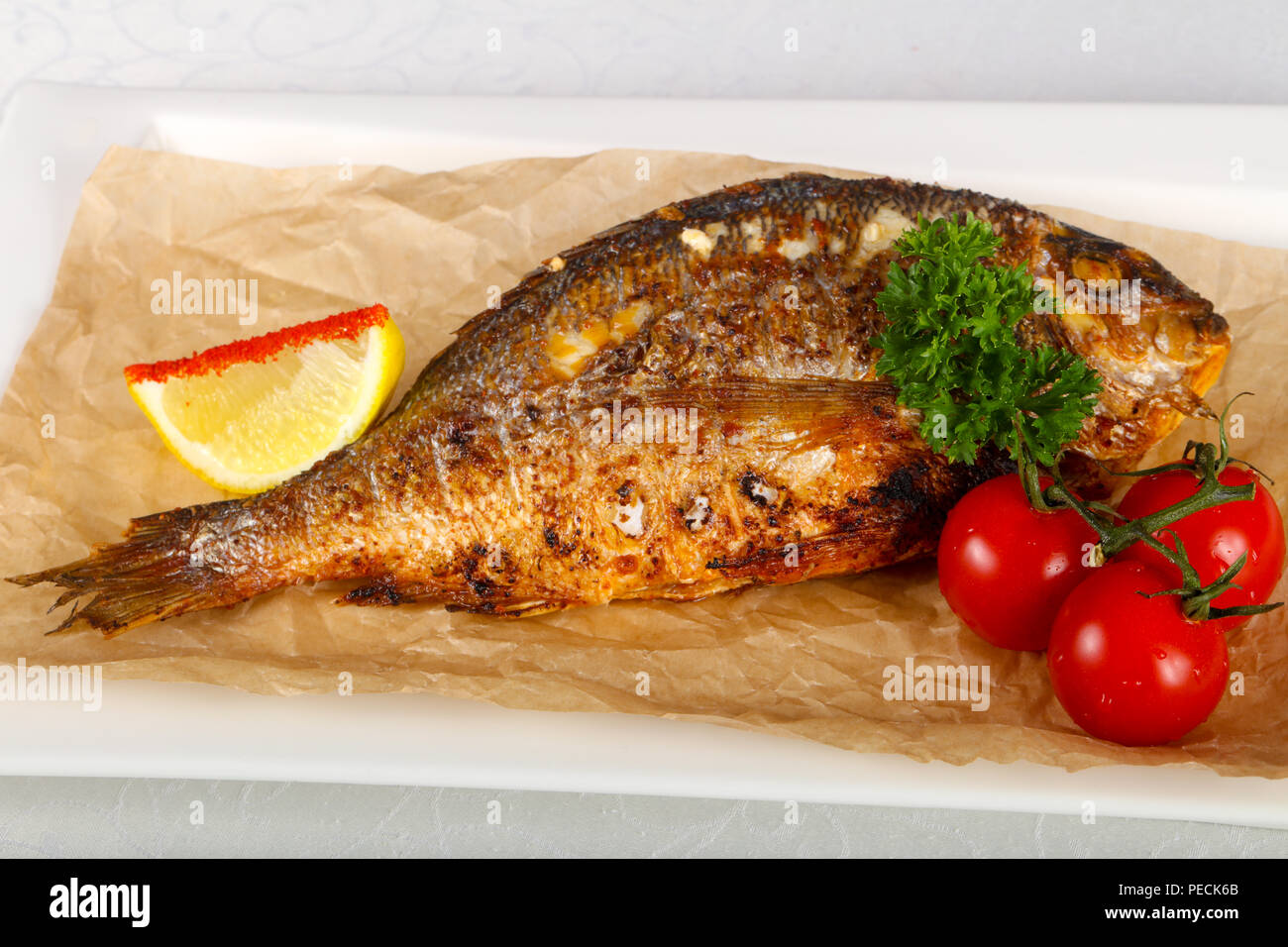 Roasted dorada fish Stock Photo - Alamy