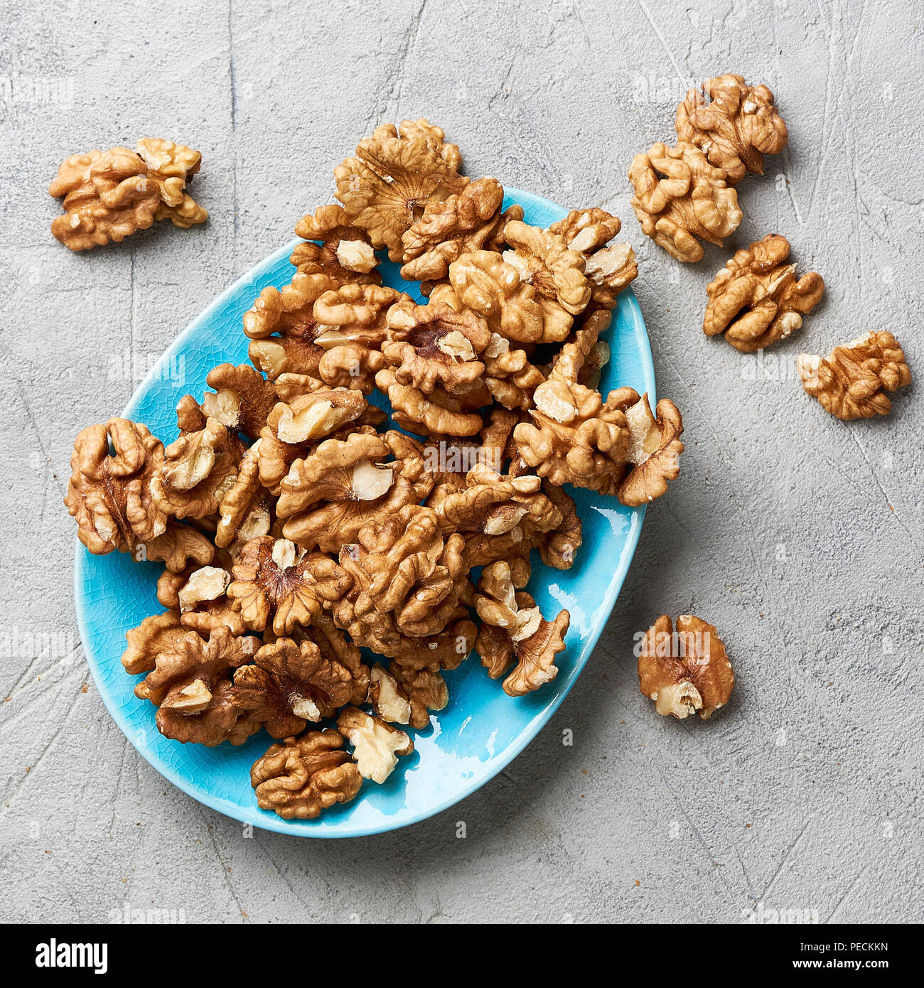 Walnut kernels on gray background Stock Photo - Alamy