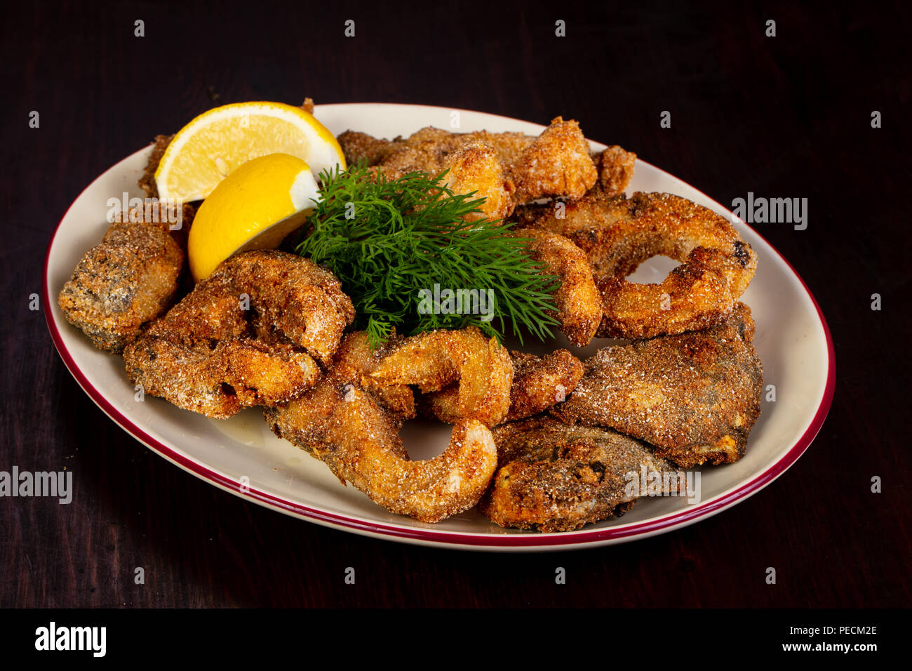 Roasted carp fish served lemon and dill Stock Photo - Alamy