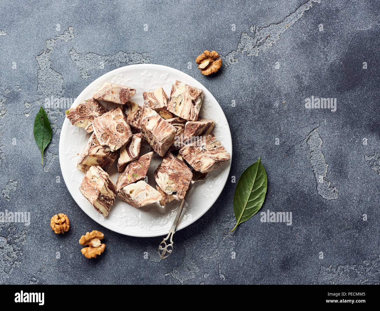 Oriental sweet dessert. Eastern halva on a white plate. Top view Stock ...