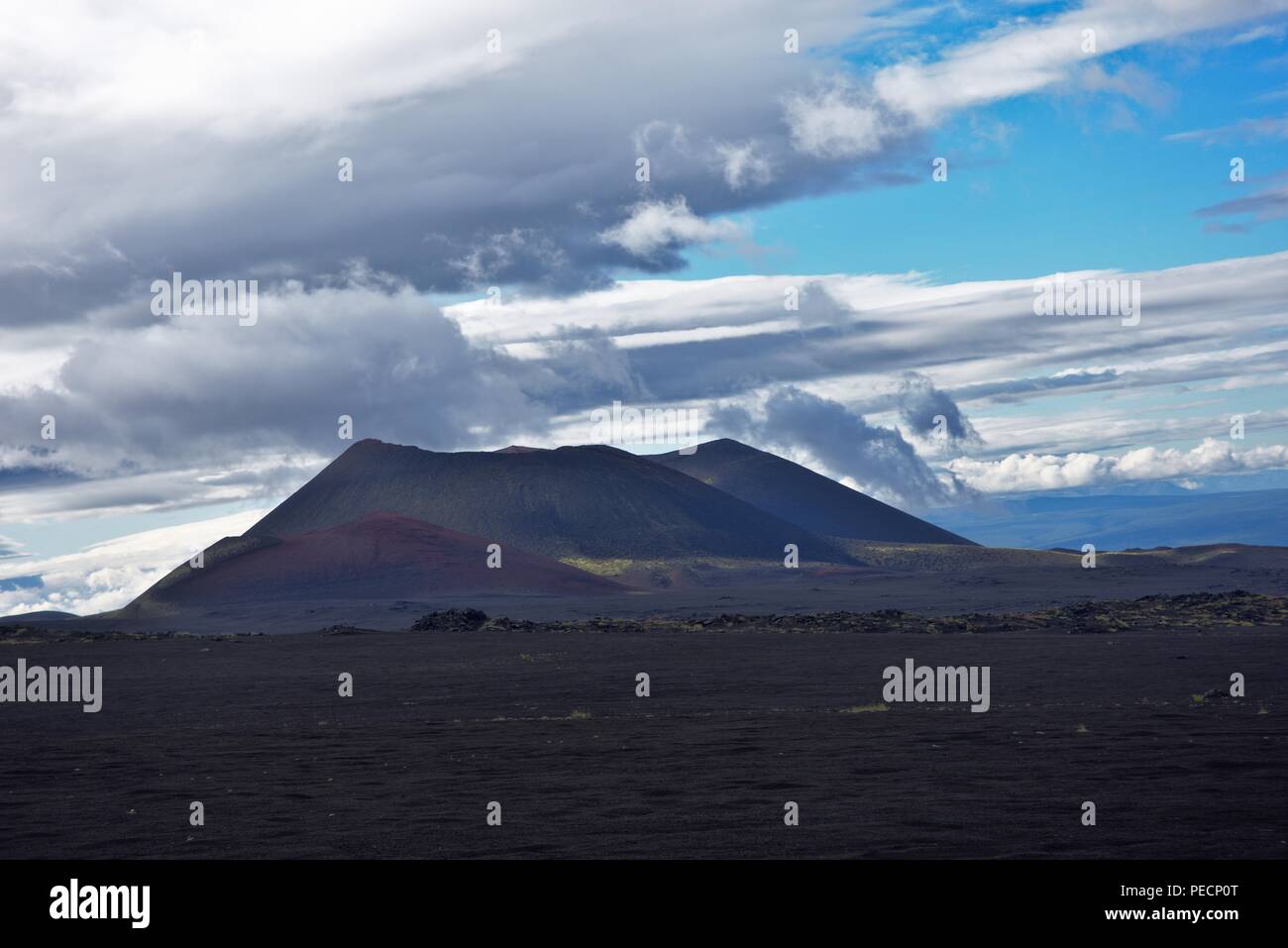 Some sopkas (volcanic hills) scenery with clouds and volcano sand ...