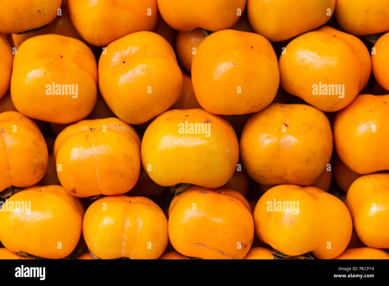 The bulk of Persimmon fruit in Thailand market Stock Photo - Alamy