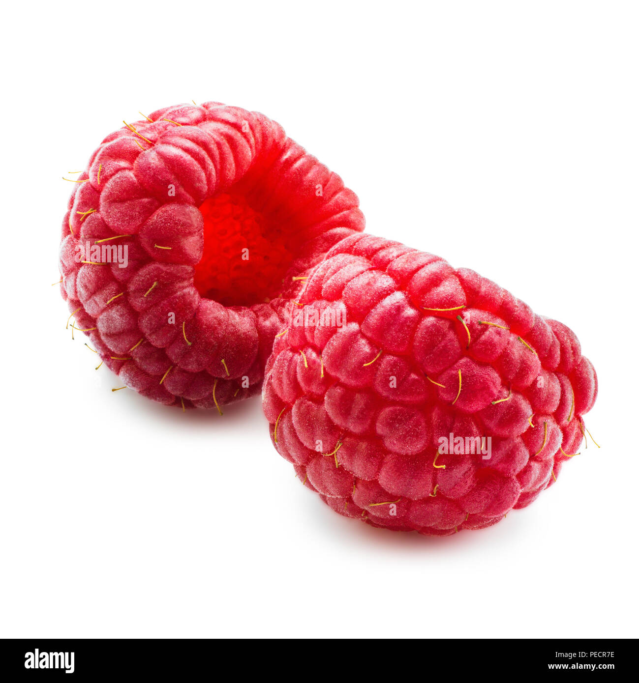 Two isolated berry. Fresh raspberry fruit on white background with ...