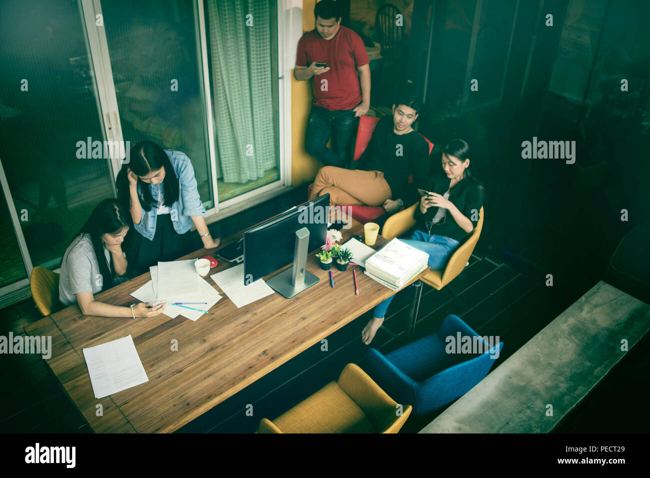asian freelance team working in home office Stock Photo - Alamy