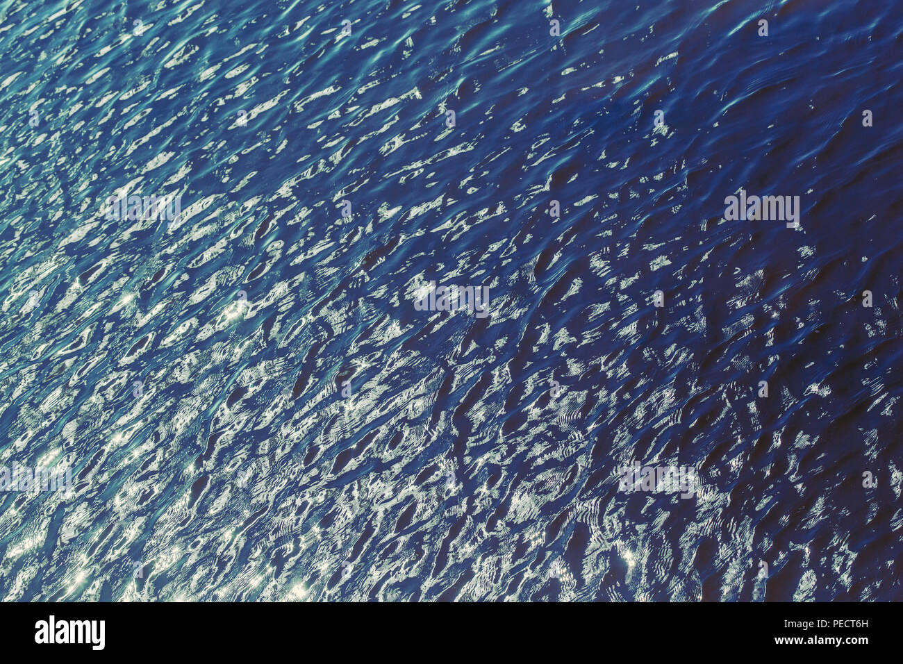 Shining blue wavy water surface ripple background, backdrop Stock Photo ...