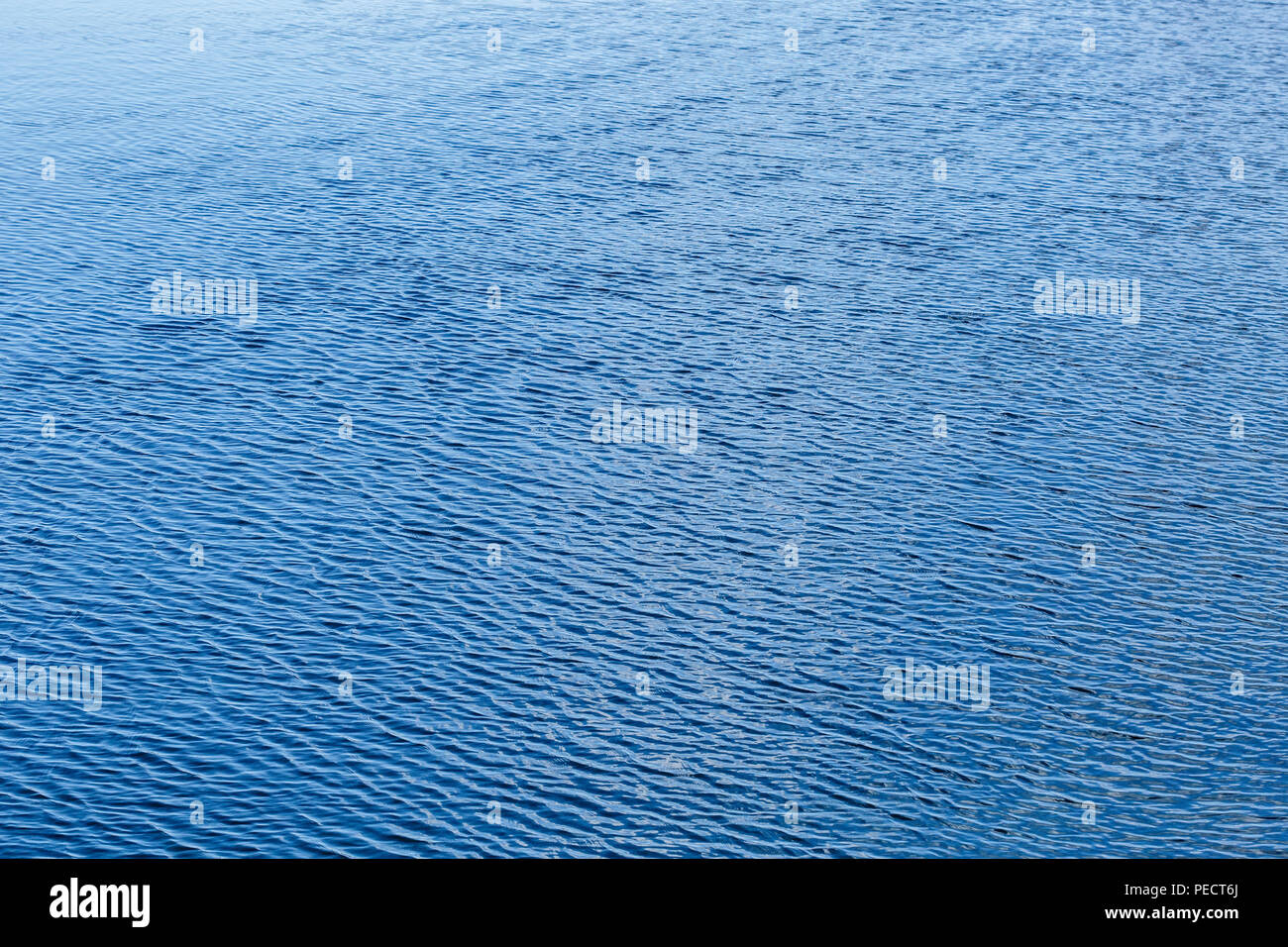 Shining blue wavy water surface ripple background, backdrop Stock Photo ...