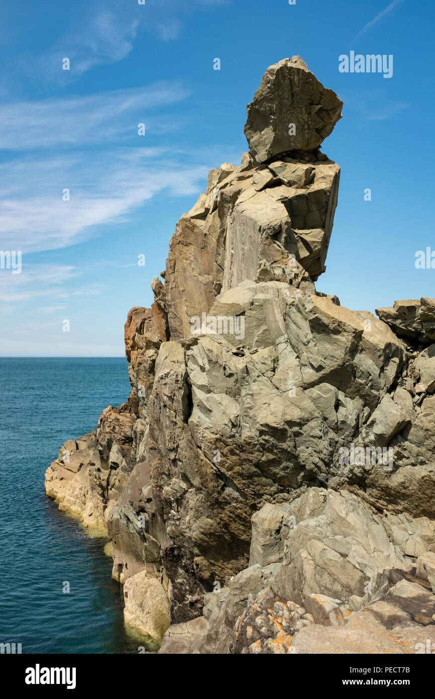Unstable granite sea cliff, Wales, UK Stock Photo - Alamy