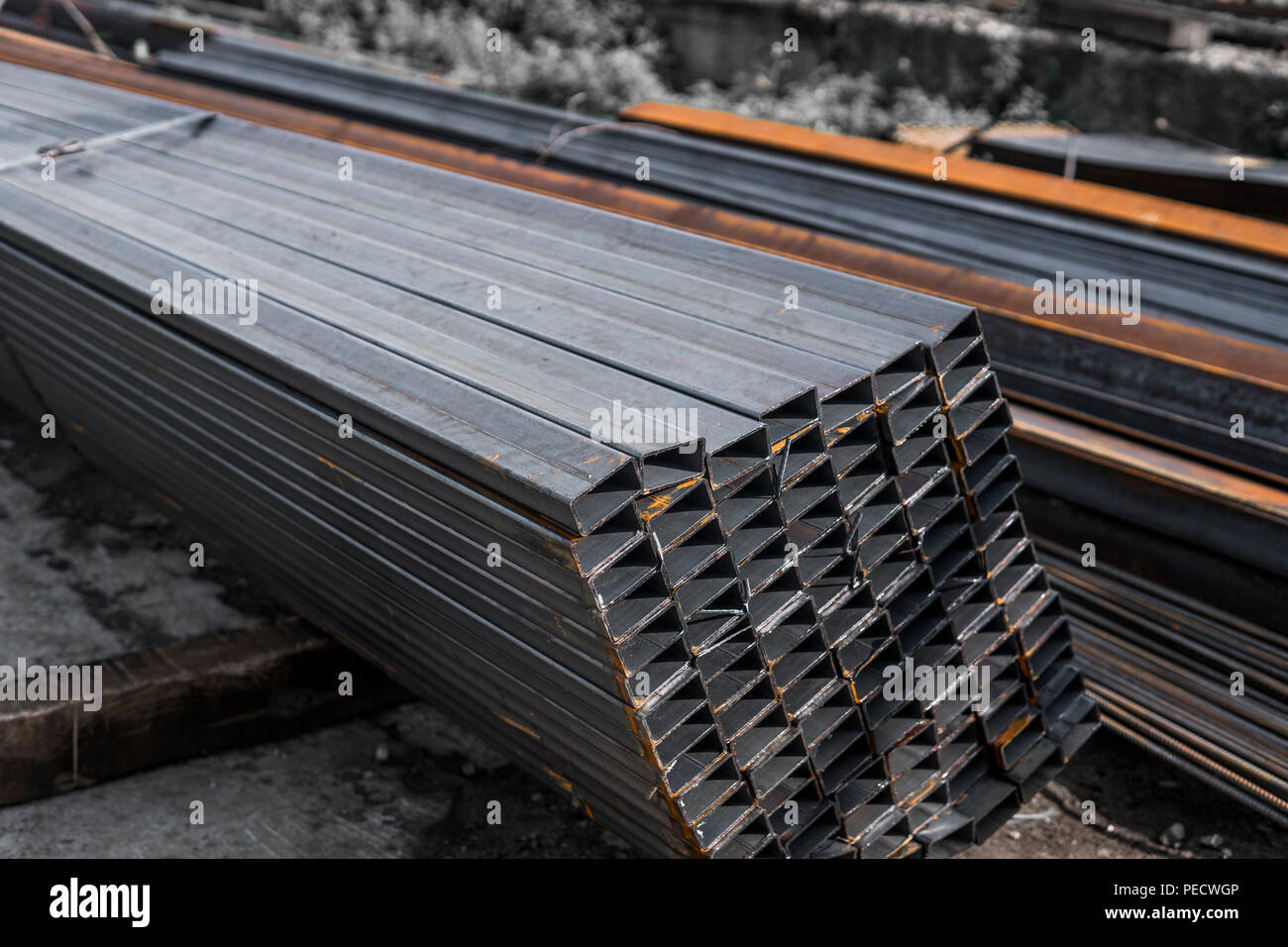 Square flat-rolled pipe metal profile in packs at the warehouse of ...