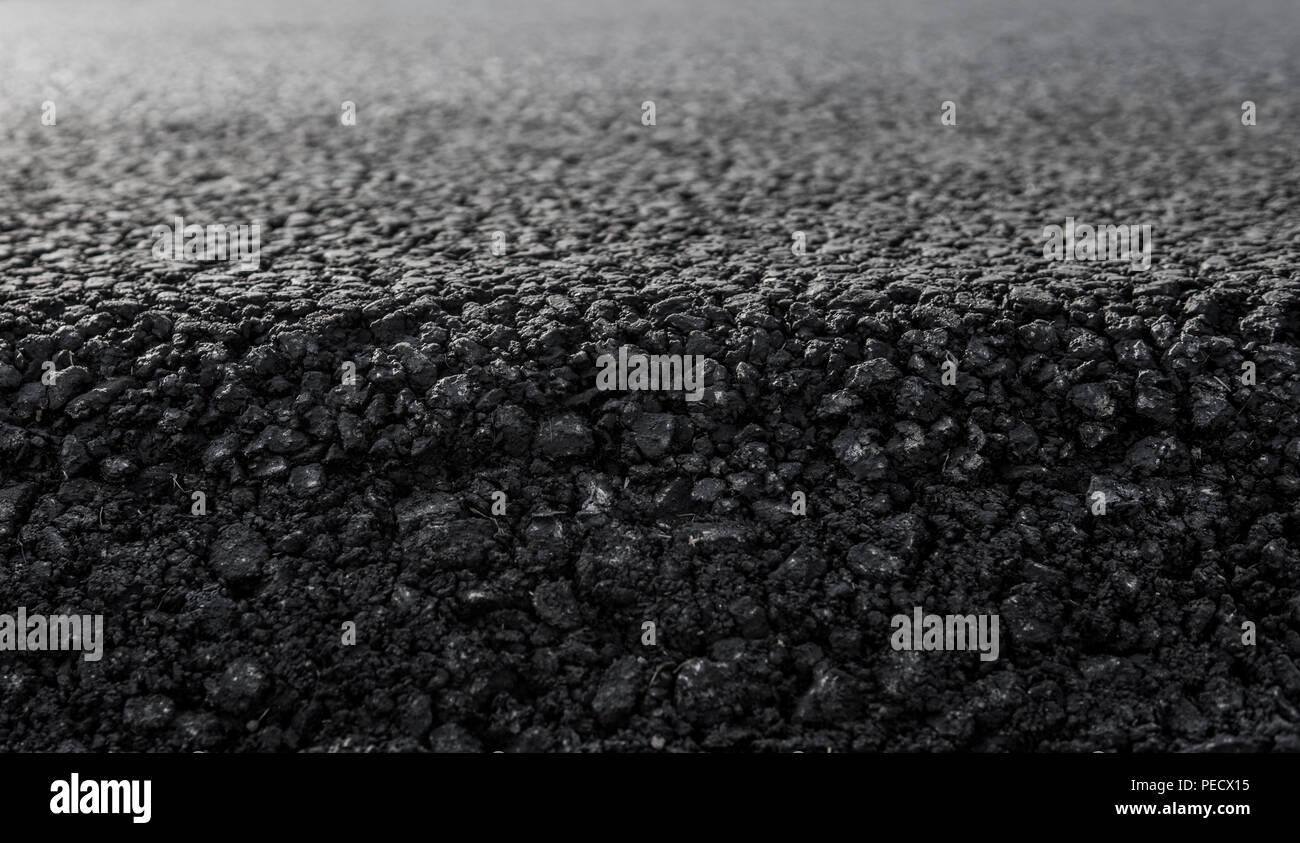 Close-up on a layer of new asphalt at the road under construction Stock ...
