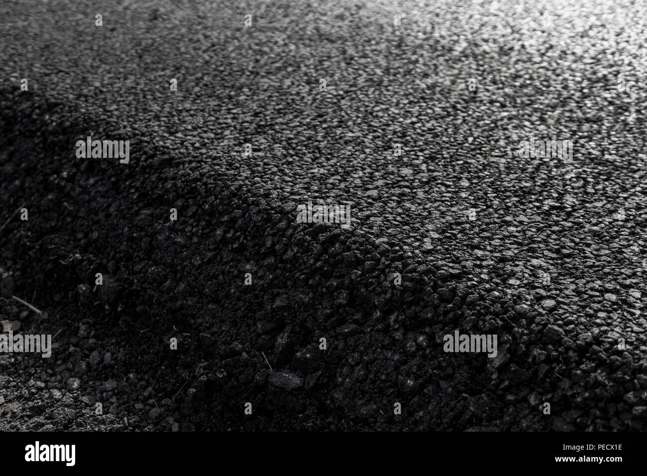 Close-up on a layer of new asphalt at the road under construction Stock ...