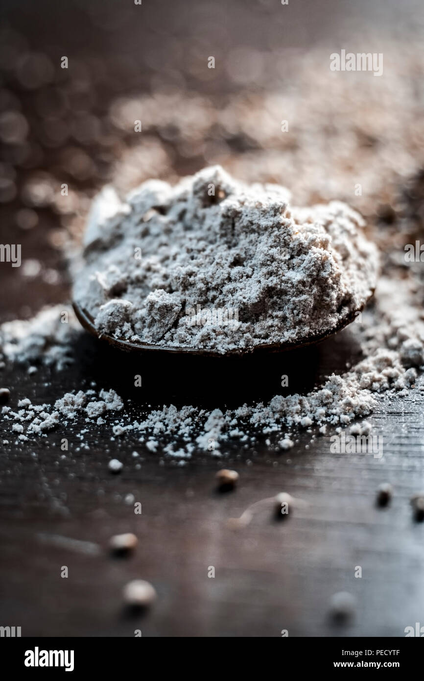 Close up of flour of pearl millet or bajra ka atta with raw pearl ...