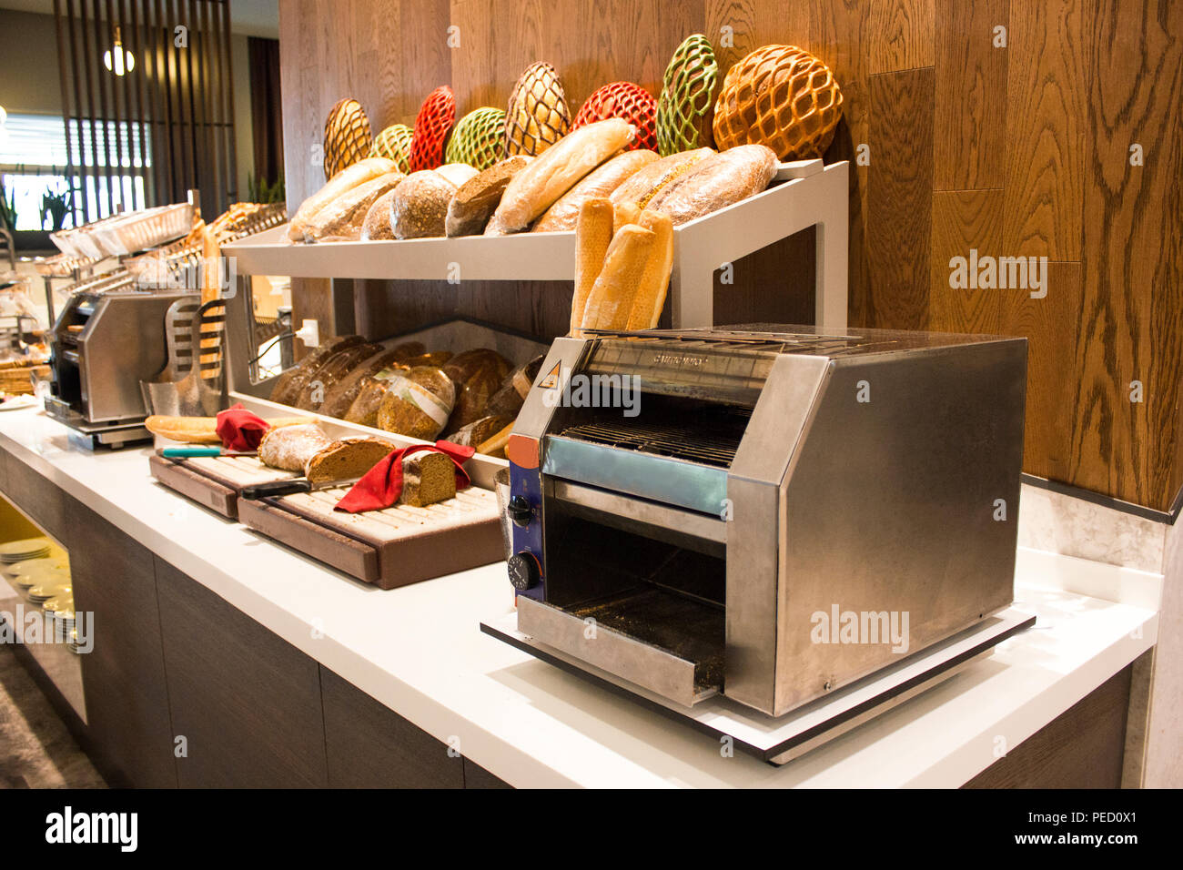 Machine for toasting bread - toaster, variety of baguettes and bread ...