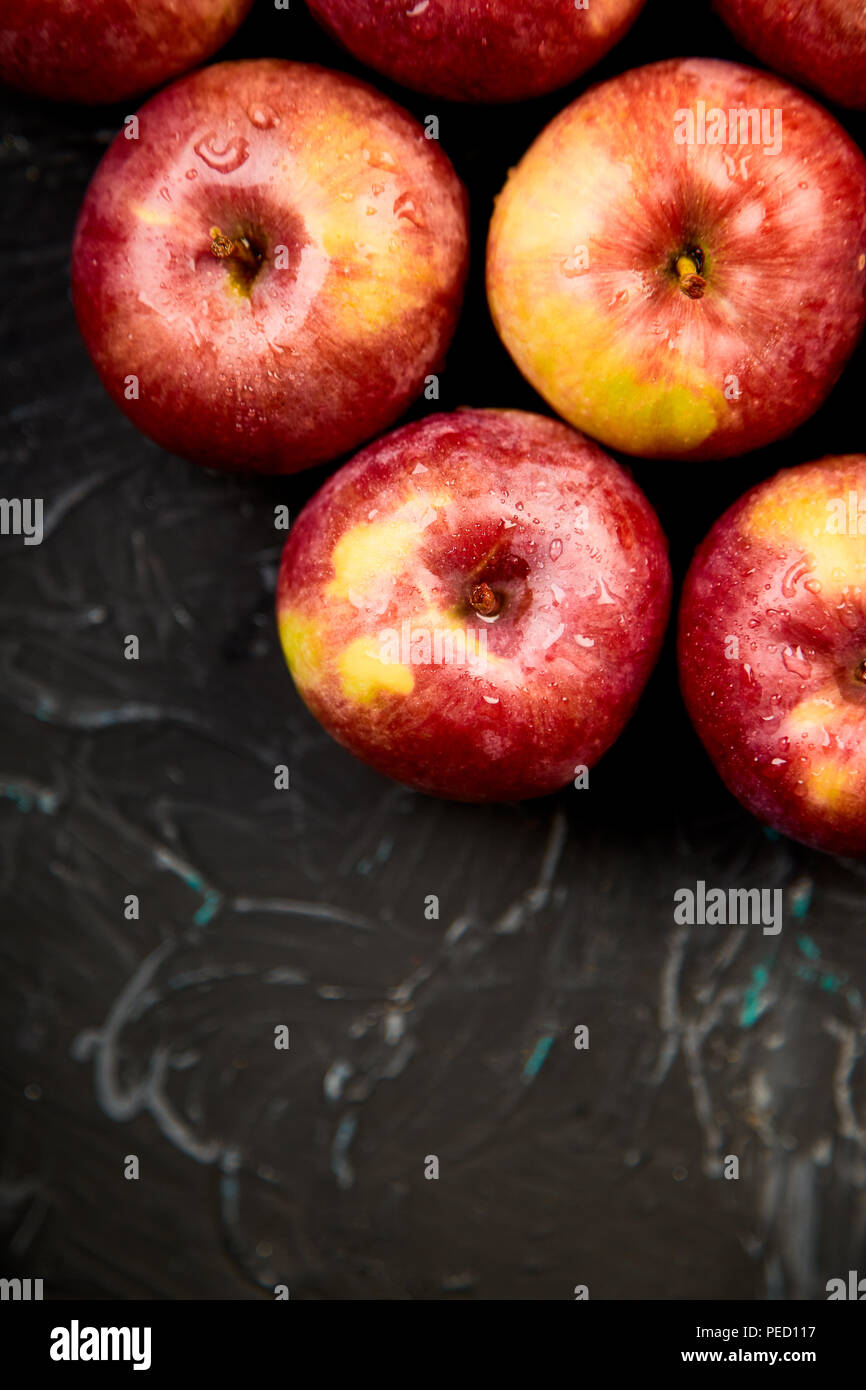 Fresh organic red apples on black background. Flat lay. Frame. Top view ...
