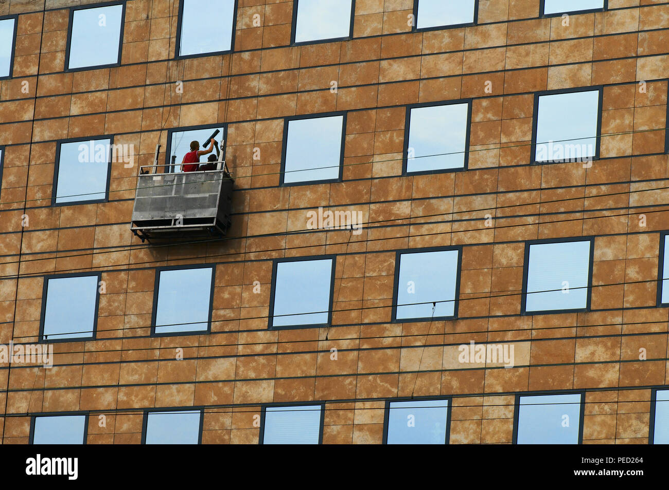 Man climbing out of window hi-res stock photography and images - Alamy