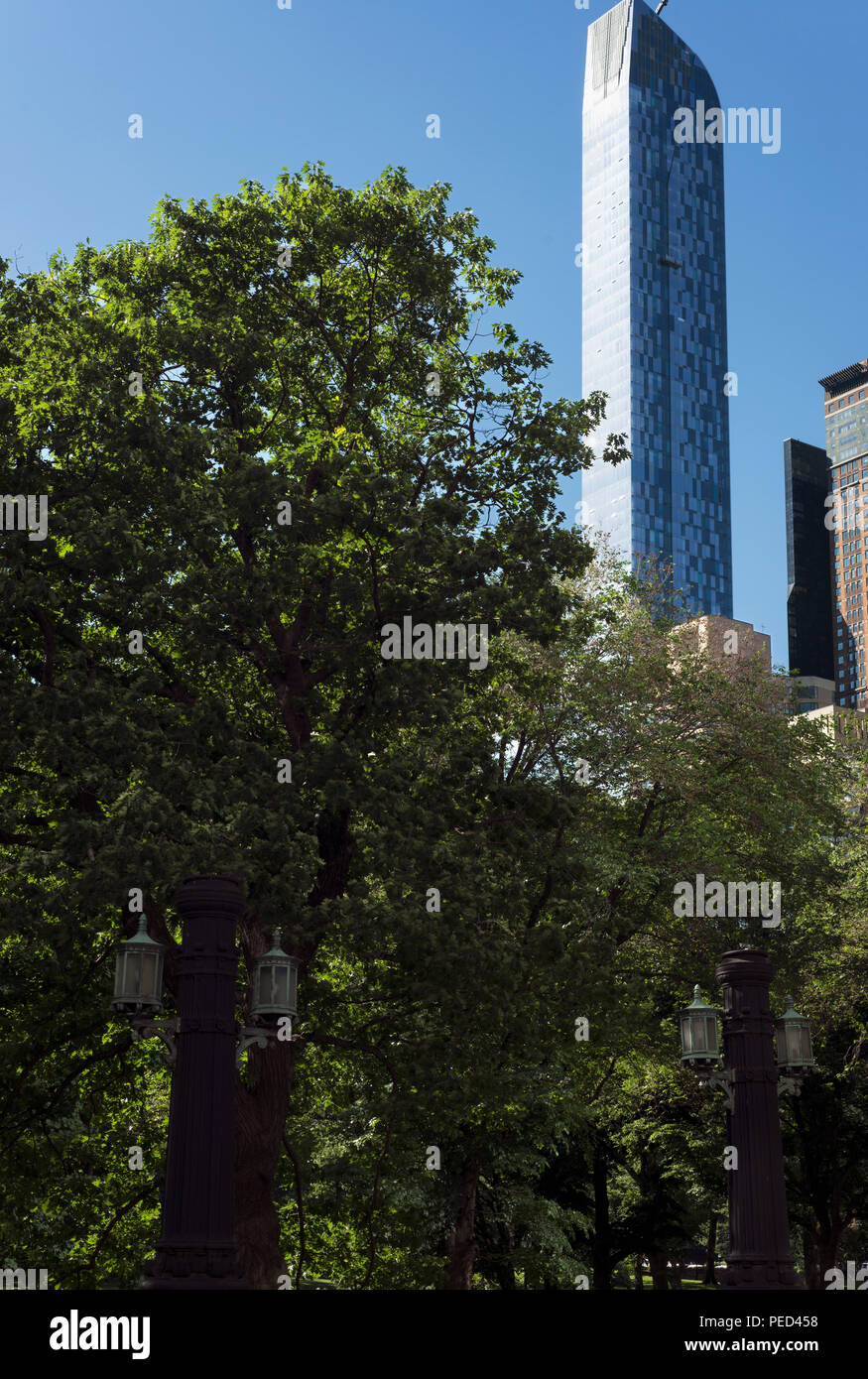 The One57 building towering over Central Park, New York Stock Photo - Alamy