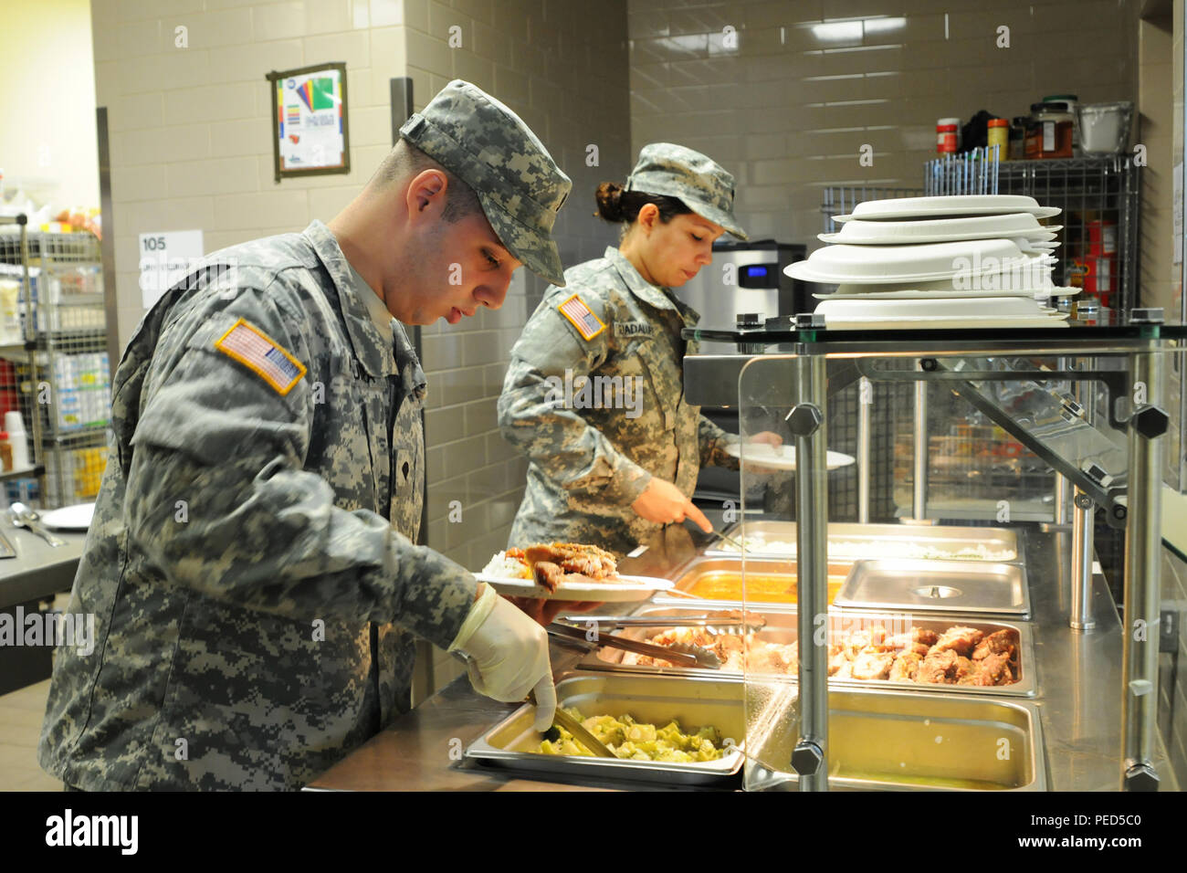 U.S. Army Reserve Spc. Edgar Anqueira and Spc. Mayori Guadalupe, food ...