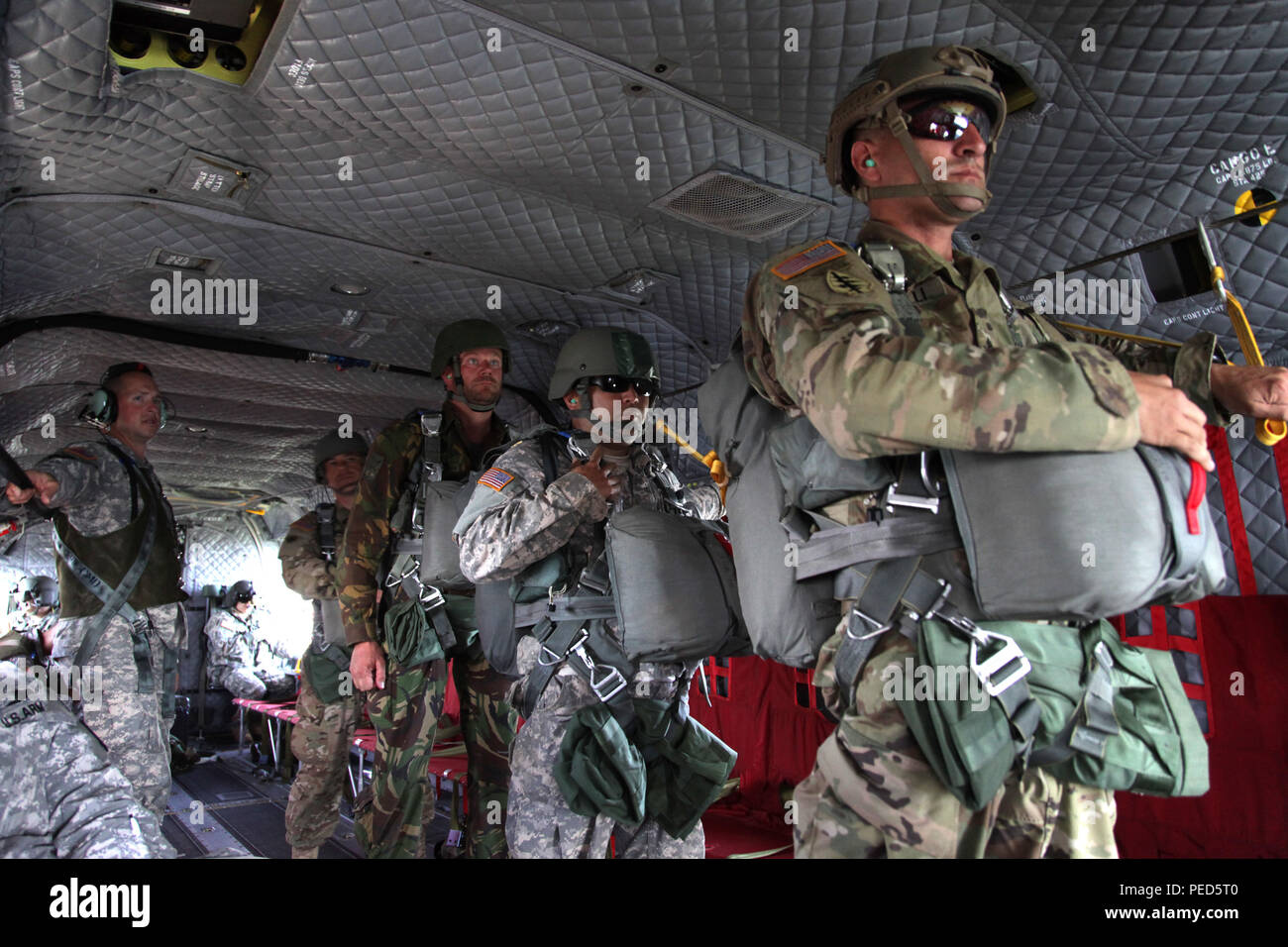 Paratroopers from the 982nd Combat Camera team stands ready to jump at ...